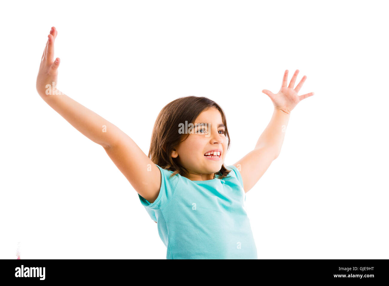 Studio portrait of a happy girl with arms raised on air Stock Photo - Alamy