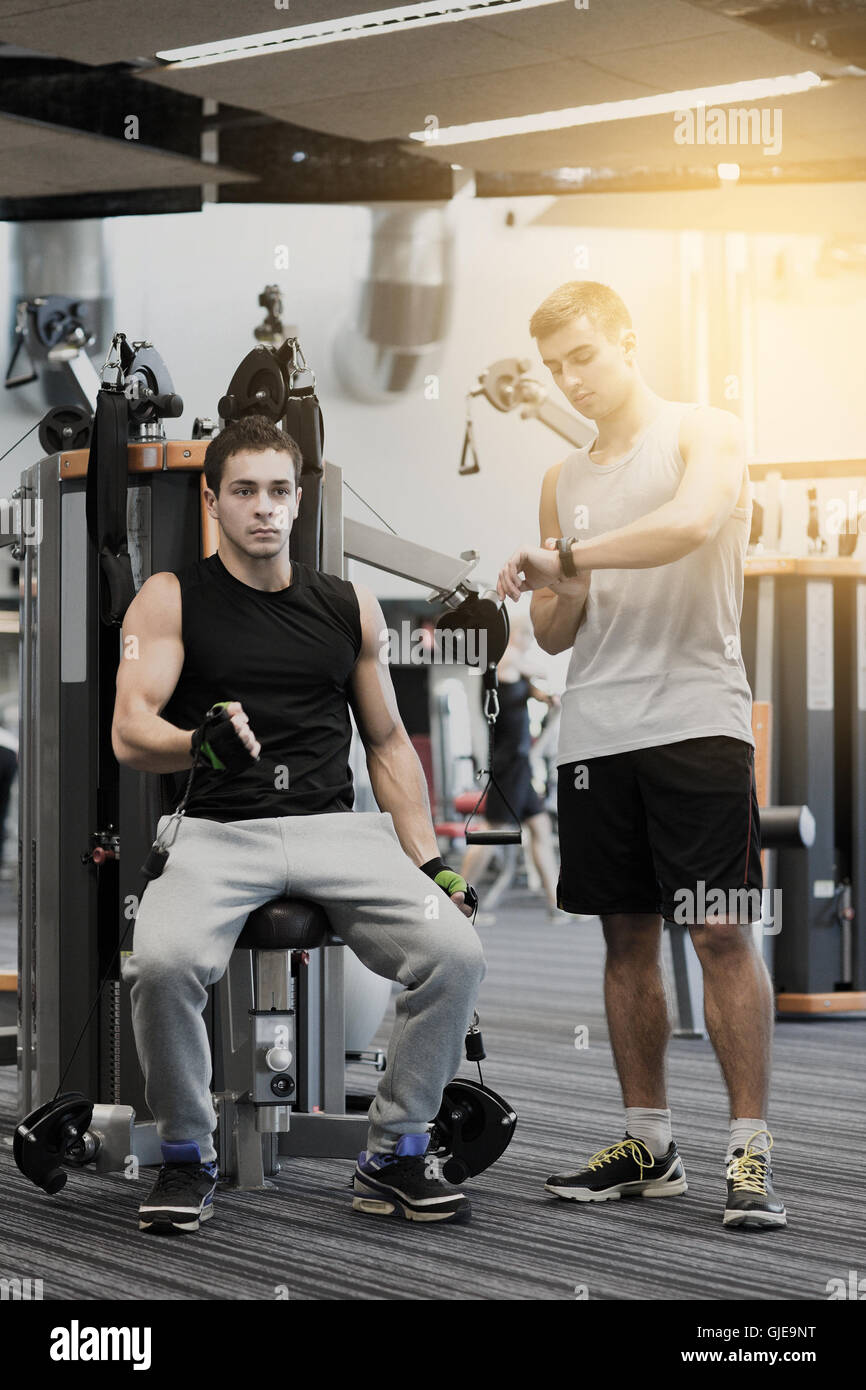 Men on machine hi-res stock photography and images - Alamy