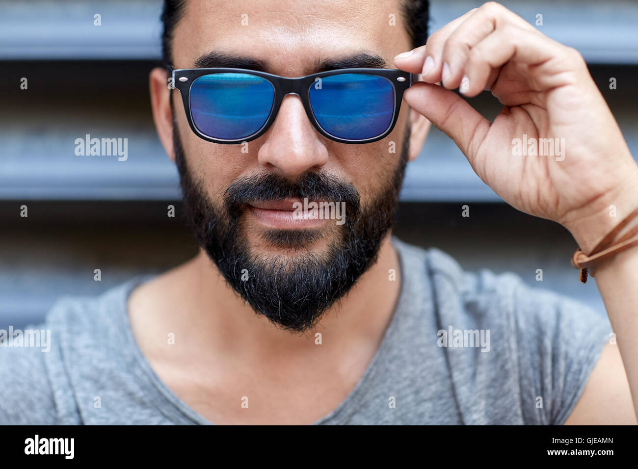 happy smiling man with beard on city street Stock Photo - Alamy