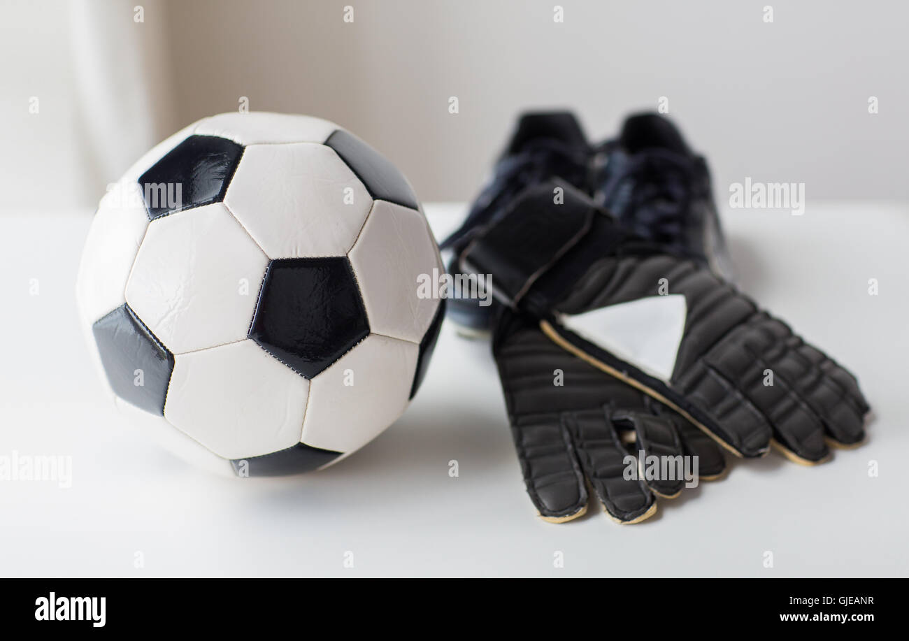 close up of soccer ball, boots and gloves on table Stock Photo - Alamy
