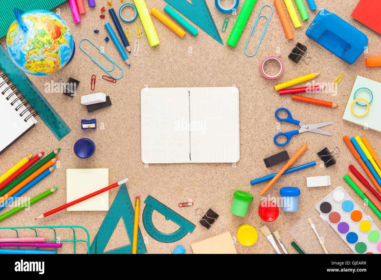 Creative multicolor desk with school, office supplies with blank open ...