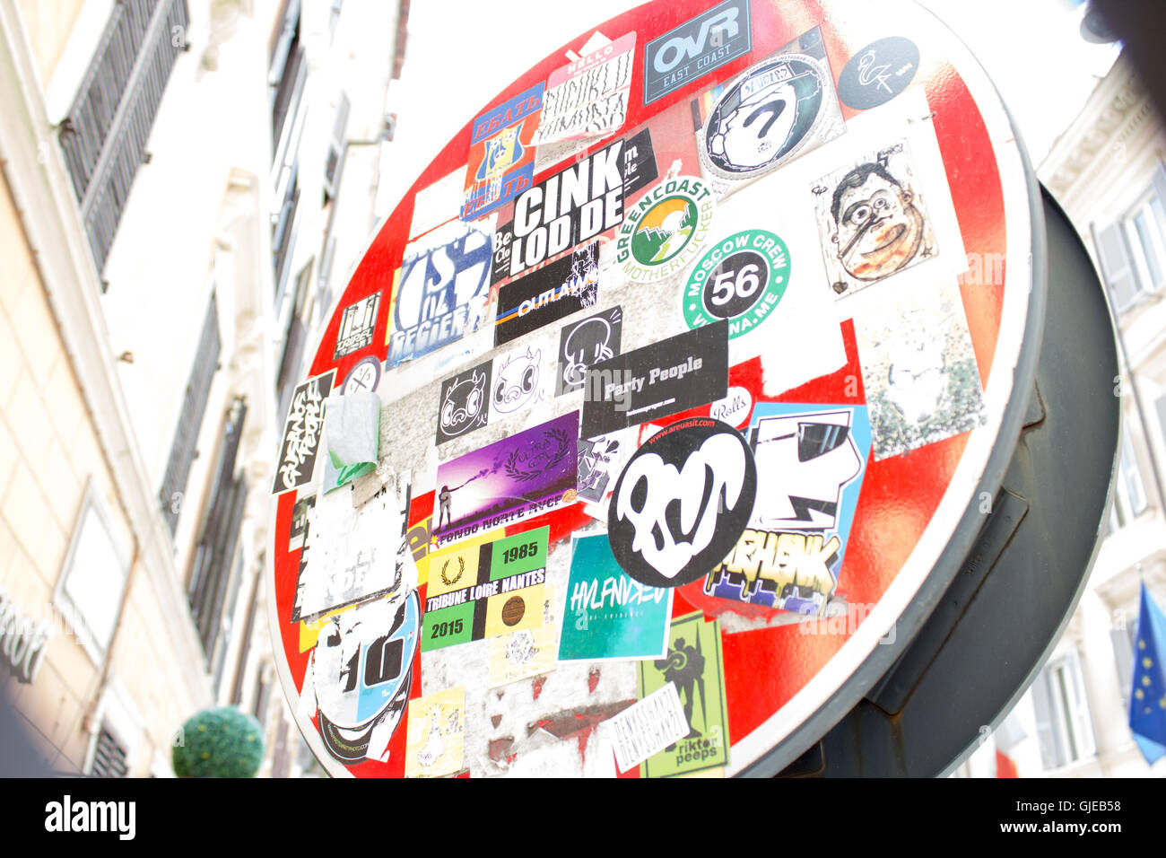 Sign covered in stickers Stock Photo - Alamy