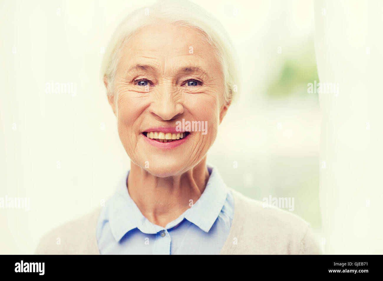 happy senior woman face at home Stock Photo - Alamy