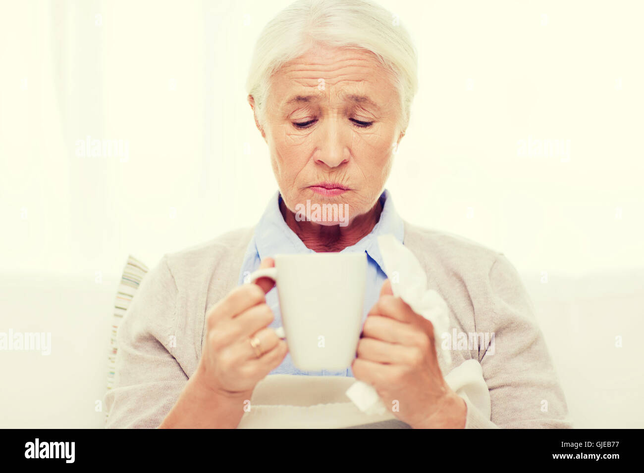 sick senior woman drinking hot tea at home Stock Photo - Alamy
