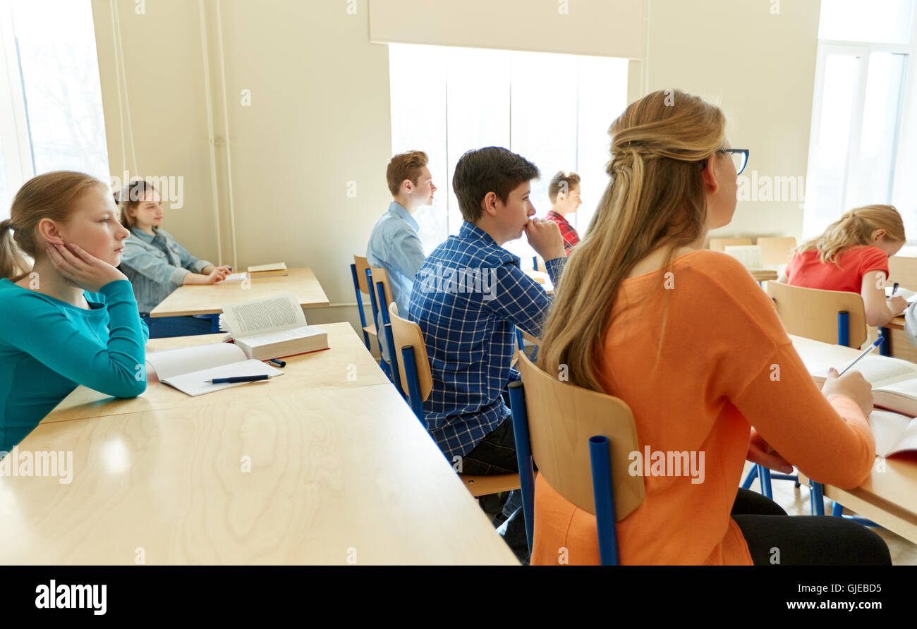 group of students with notebooks at school lesson Stock Photo - Alamy