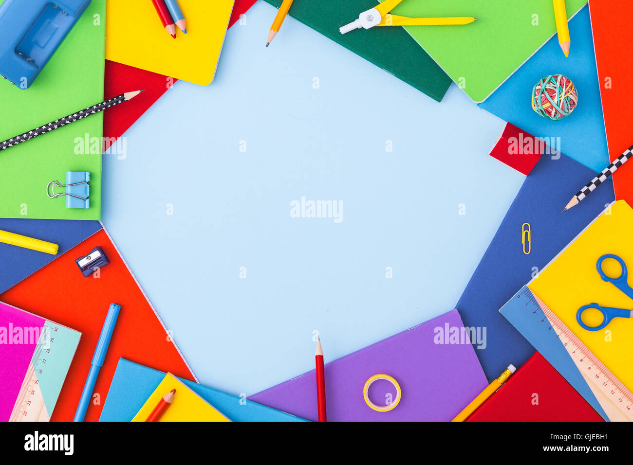 Back to school background with copy space. Colorful supplies around ...