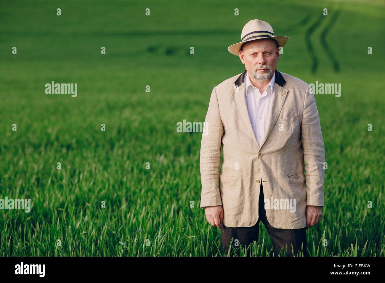 old man in field Stock Photo - Alamy