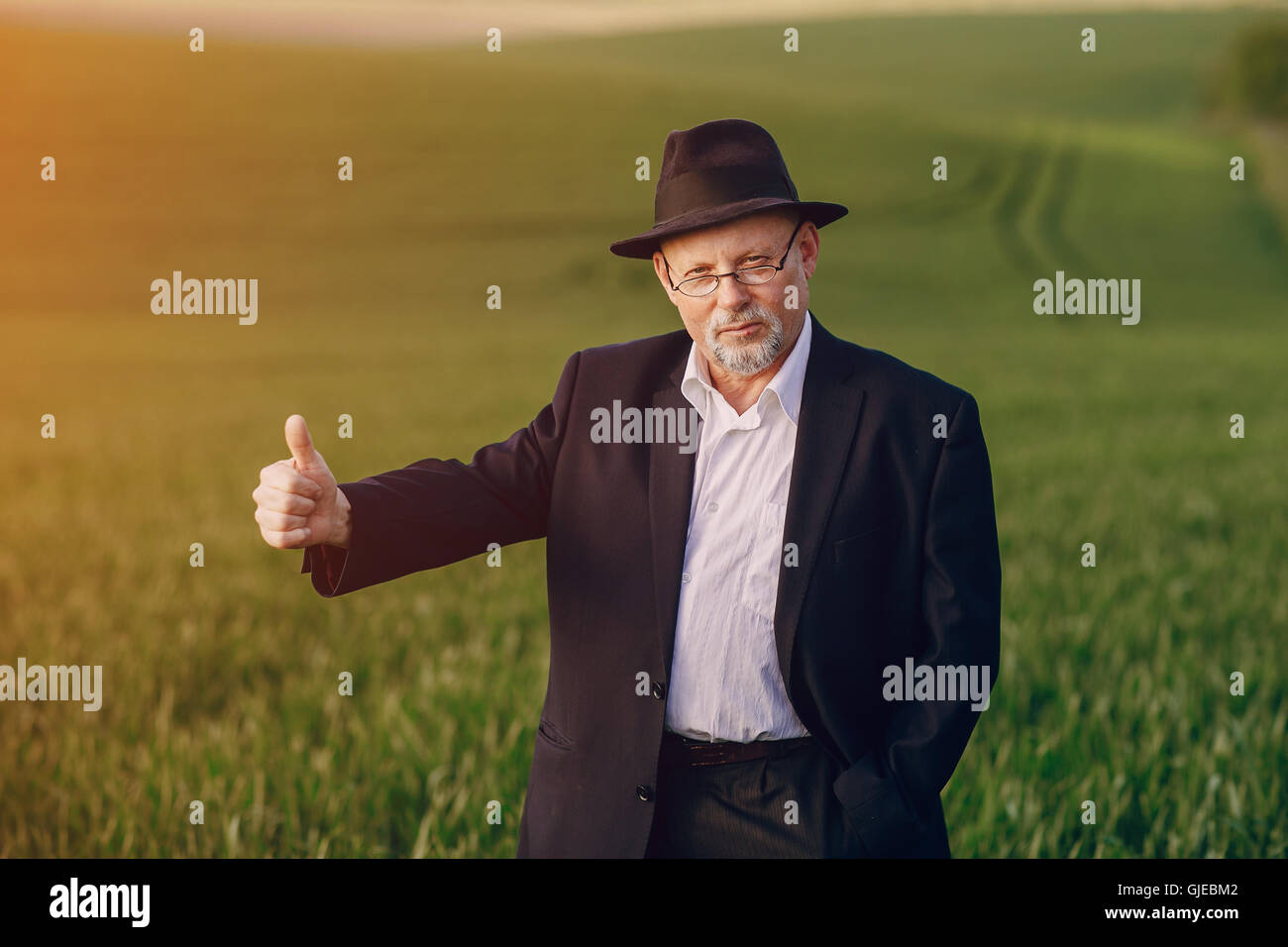 old man in field Stock Photo - Alamy
