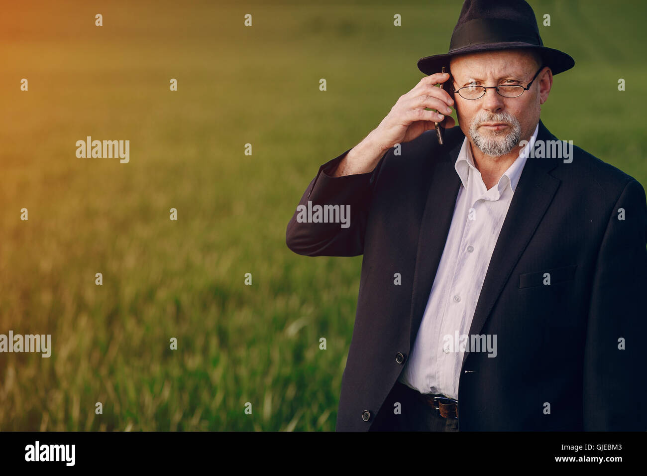 old man in field Stock Photo - Alamy