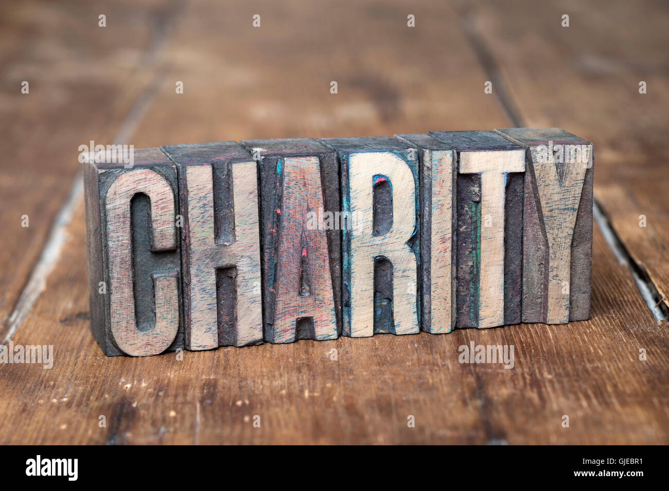 charity word made from wooden letterpress type on grunge wood Stock ...