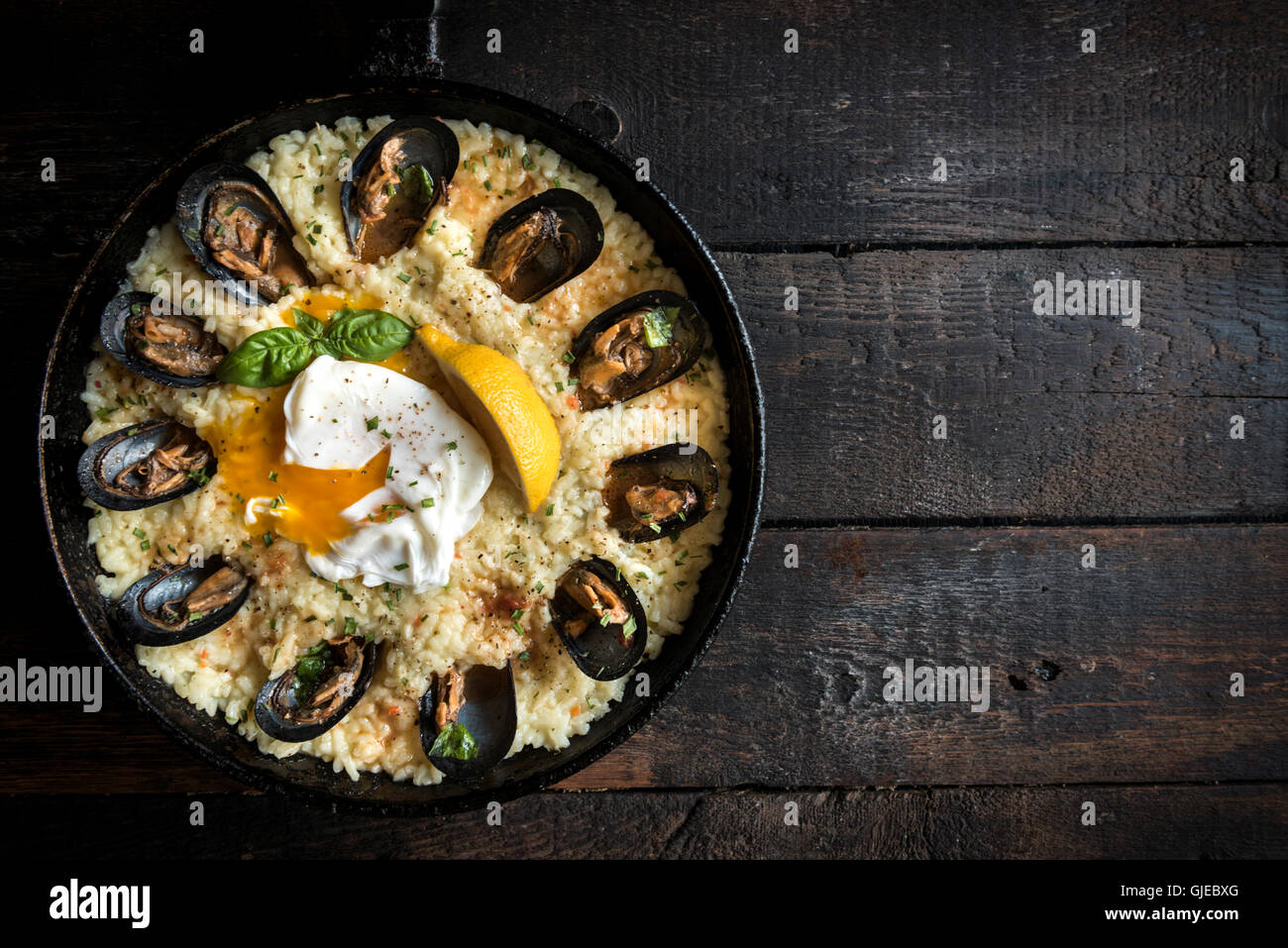 Cooked mussels with sauce and rice in the pan,empty space Stock Photo ...