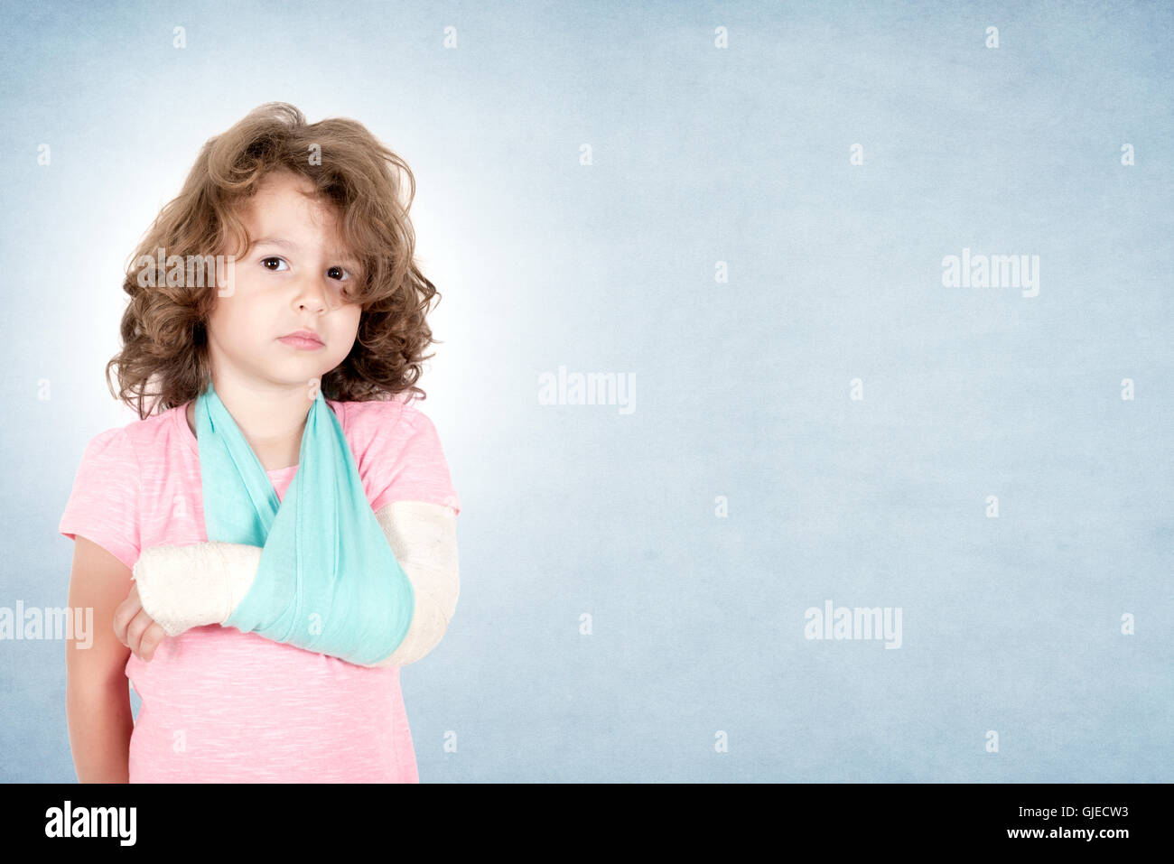 Little child with the broken hand,empty space Stock Photo - Alamy
