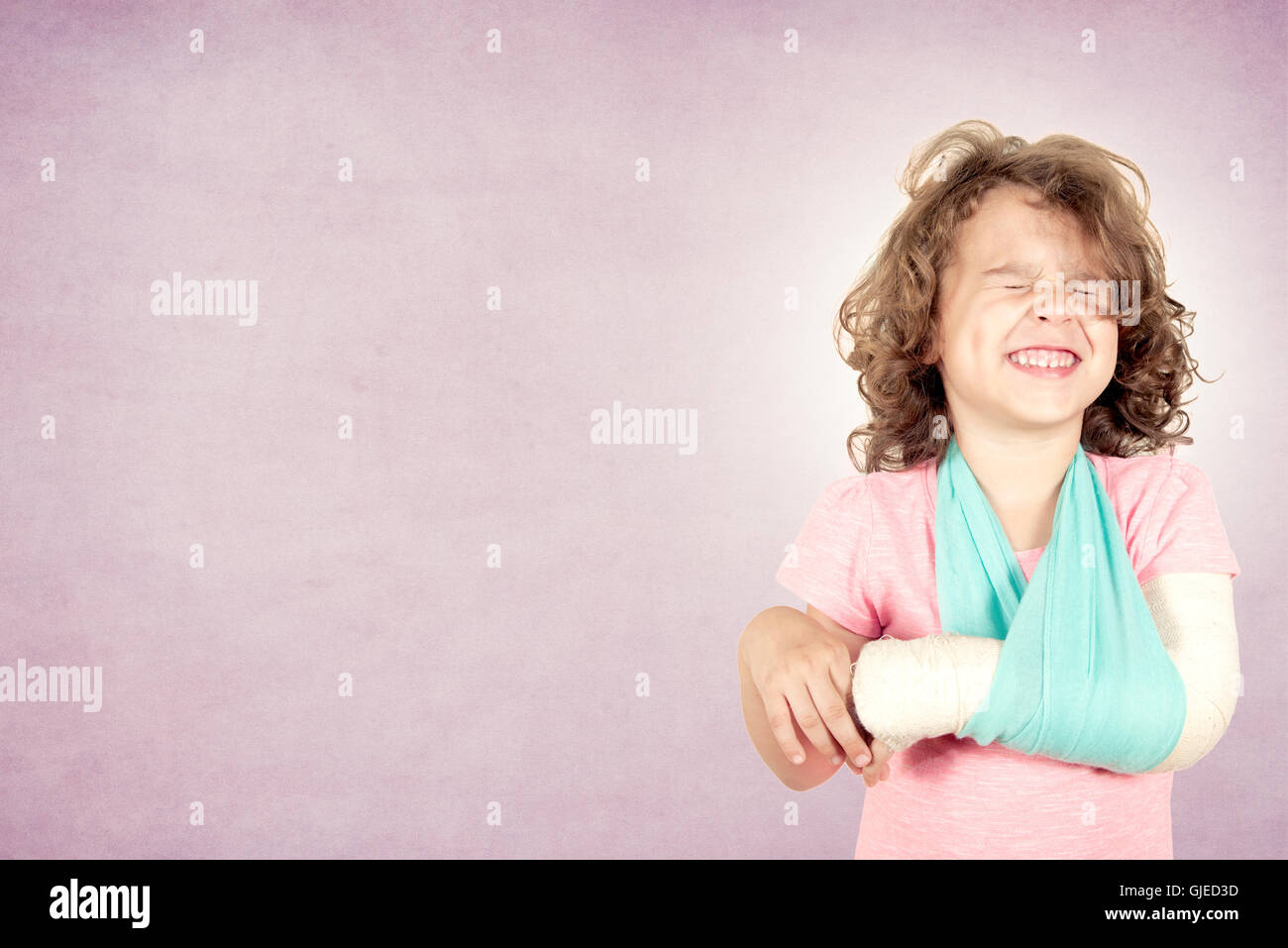 Painful facial expression on kid with broken hand,blank space Stock ...