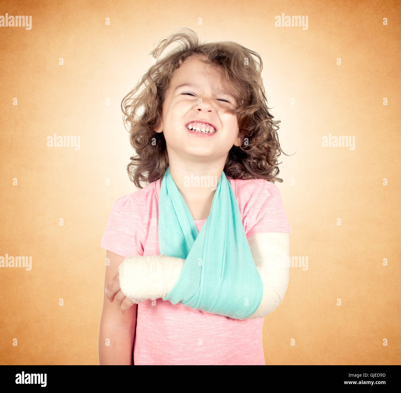 Painful facial expression on kid with broken hand Stock Photo - Alamy