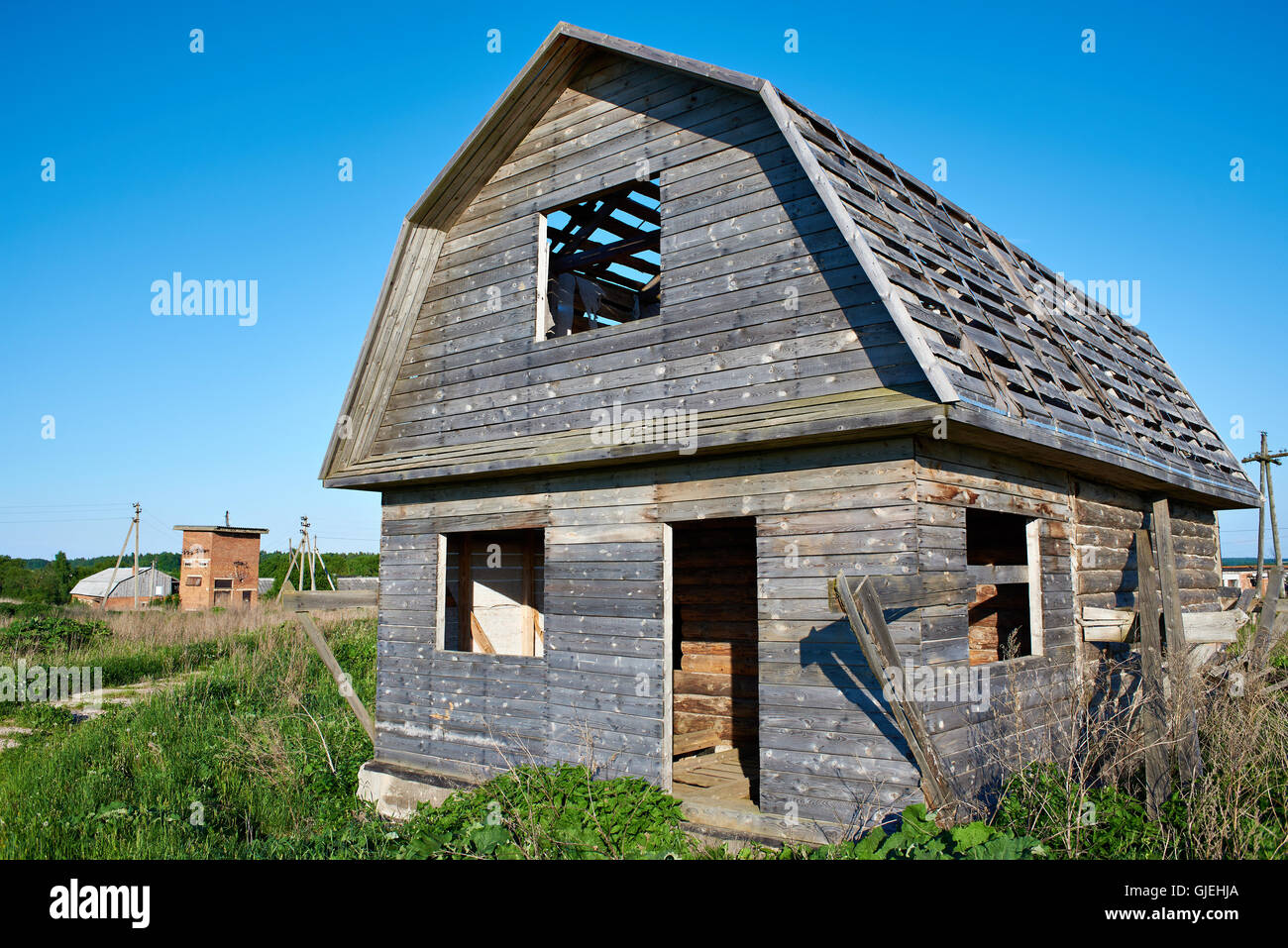 Old unfinished wooden house in the village Stock Photo - Alamy