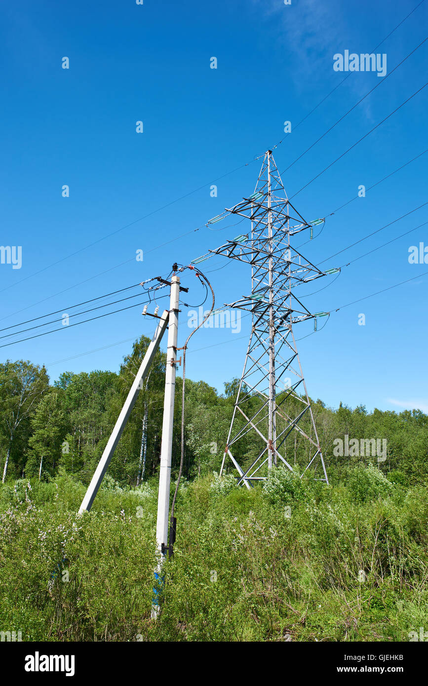 High-voltage power line on rural road landscape Stock Photo - Alamy