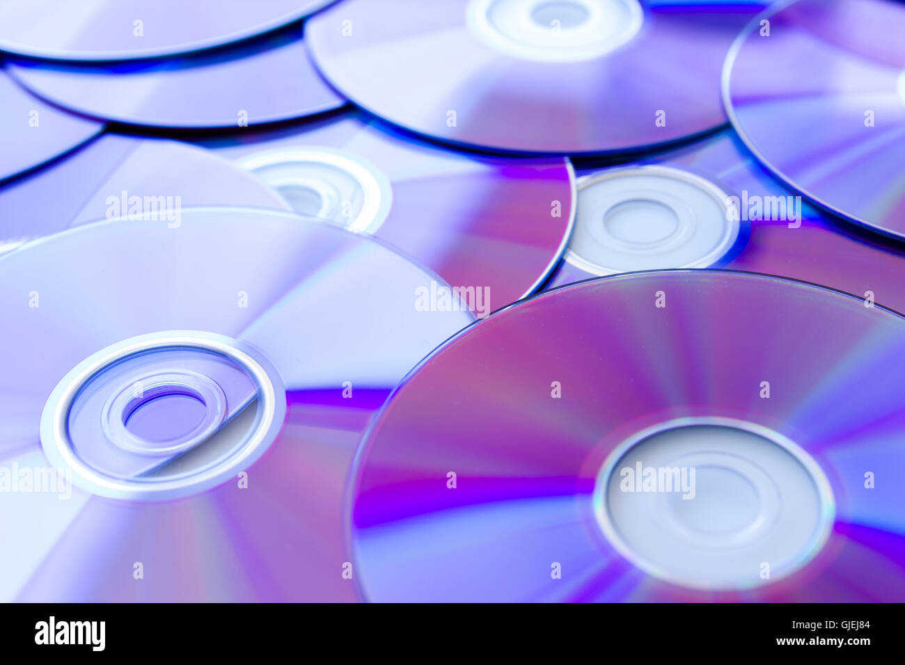 Many Compact Discs scattered seen up close Stock Photo - Alamy