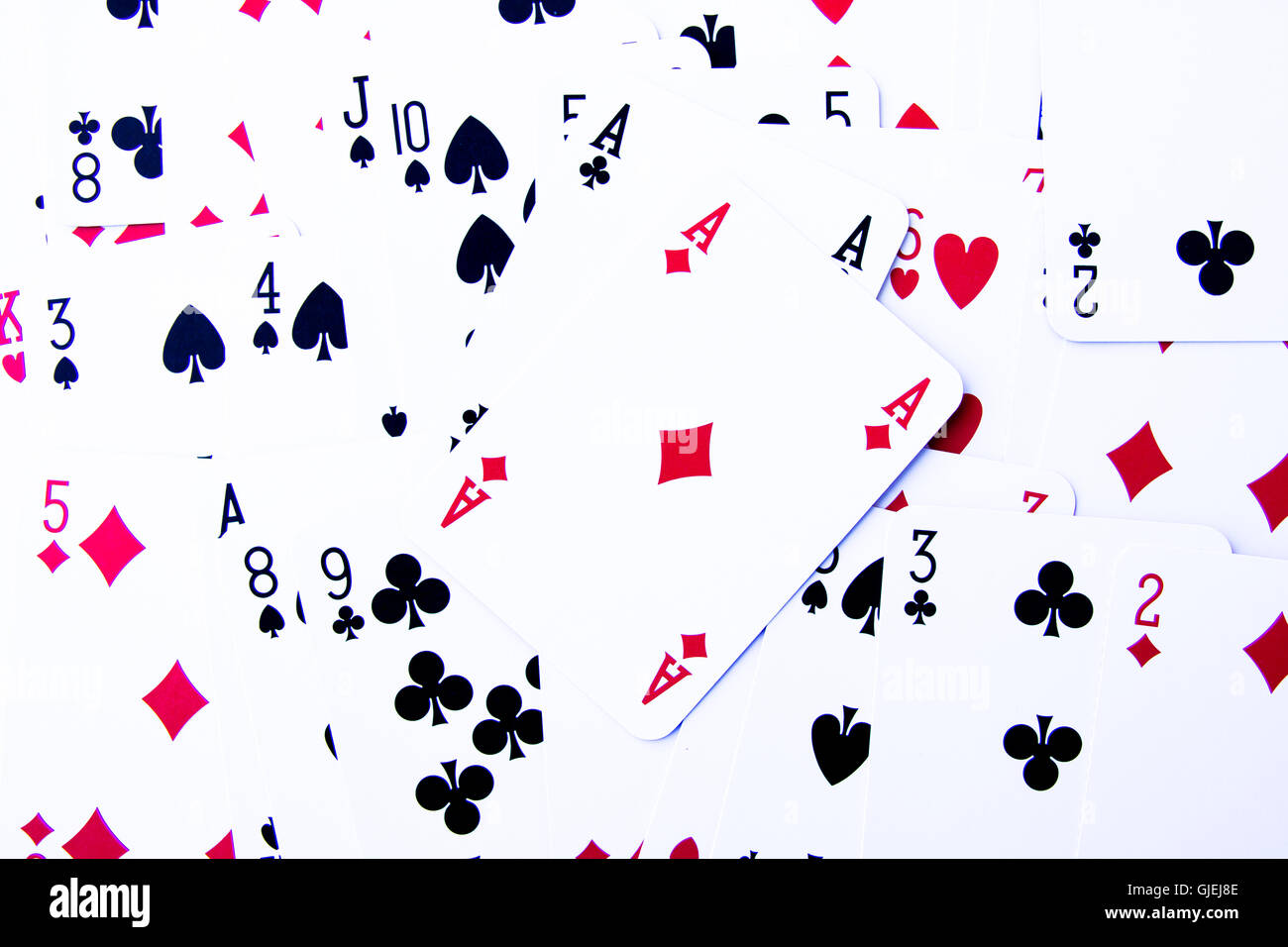 Many traditional poker cards scattered top views Stock Photo - Alamy