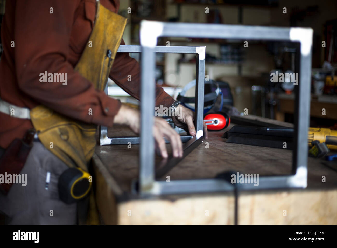 Custom furniture craftsman assembles stool support structure Stock ...