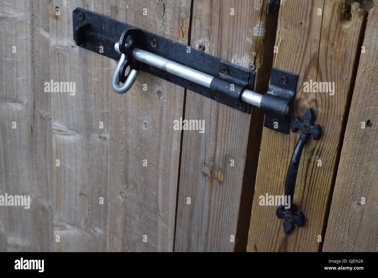 Black Lock on a Wooden Door Stock Photo - Alamy