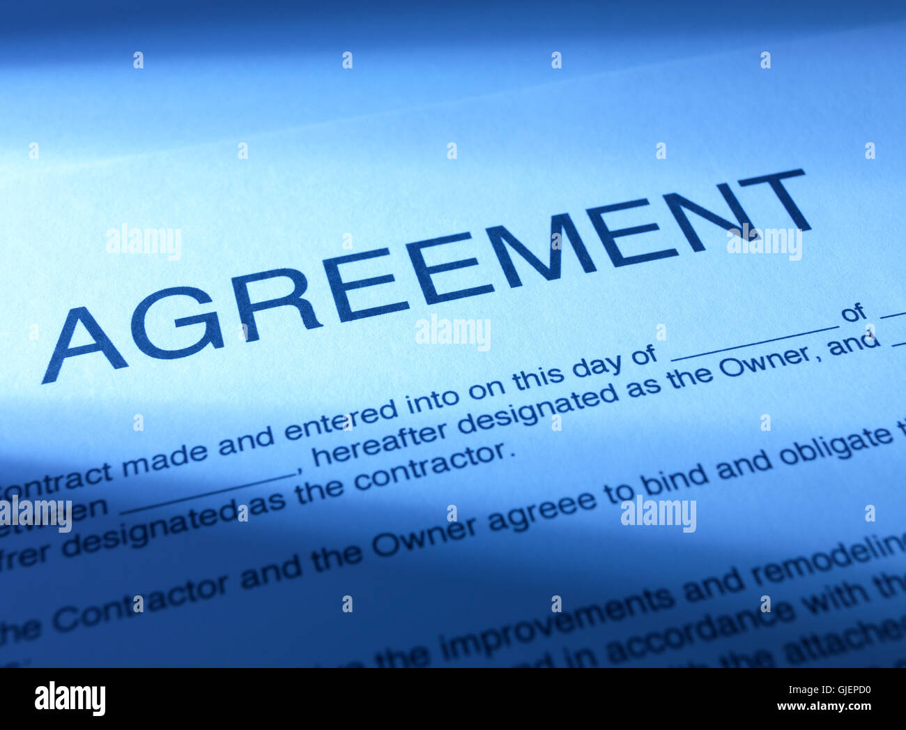 Agreement in blue Stock Photo - Alamy