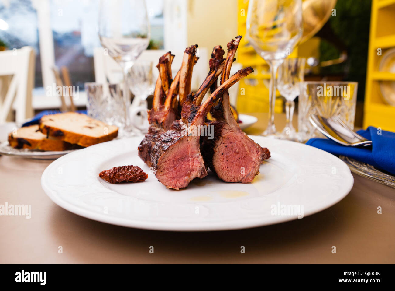 Lamb rack on a plate Stock Photo - Alamy