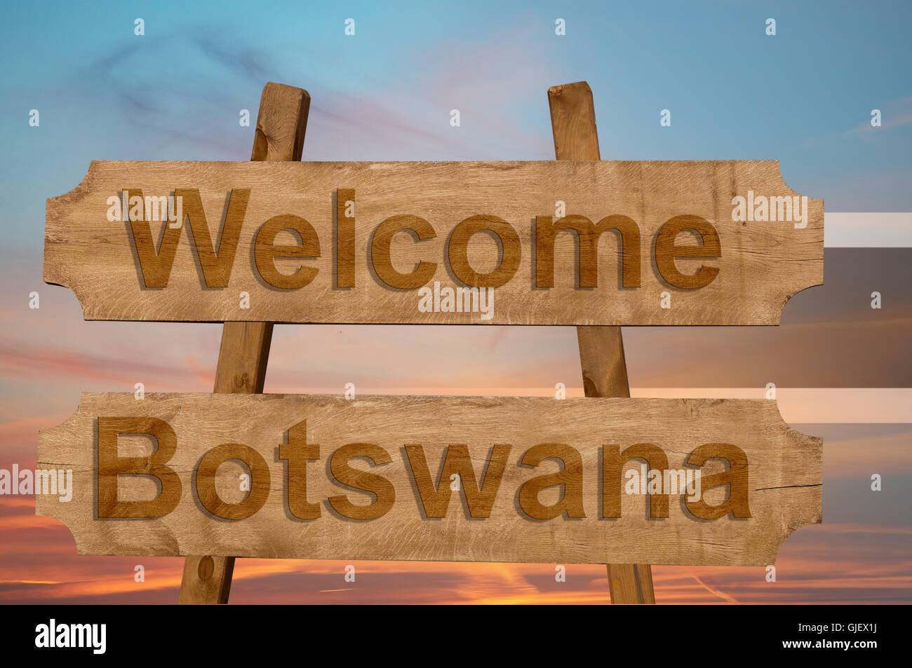 Welcome to Botswana sing on wood background with blending national flag ...