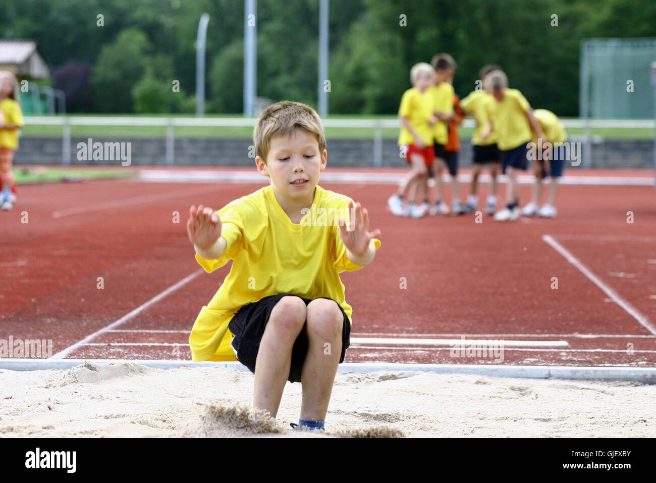 Child jumping up athletics hi-res stock photography and images - Alamy