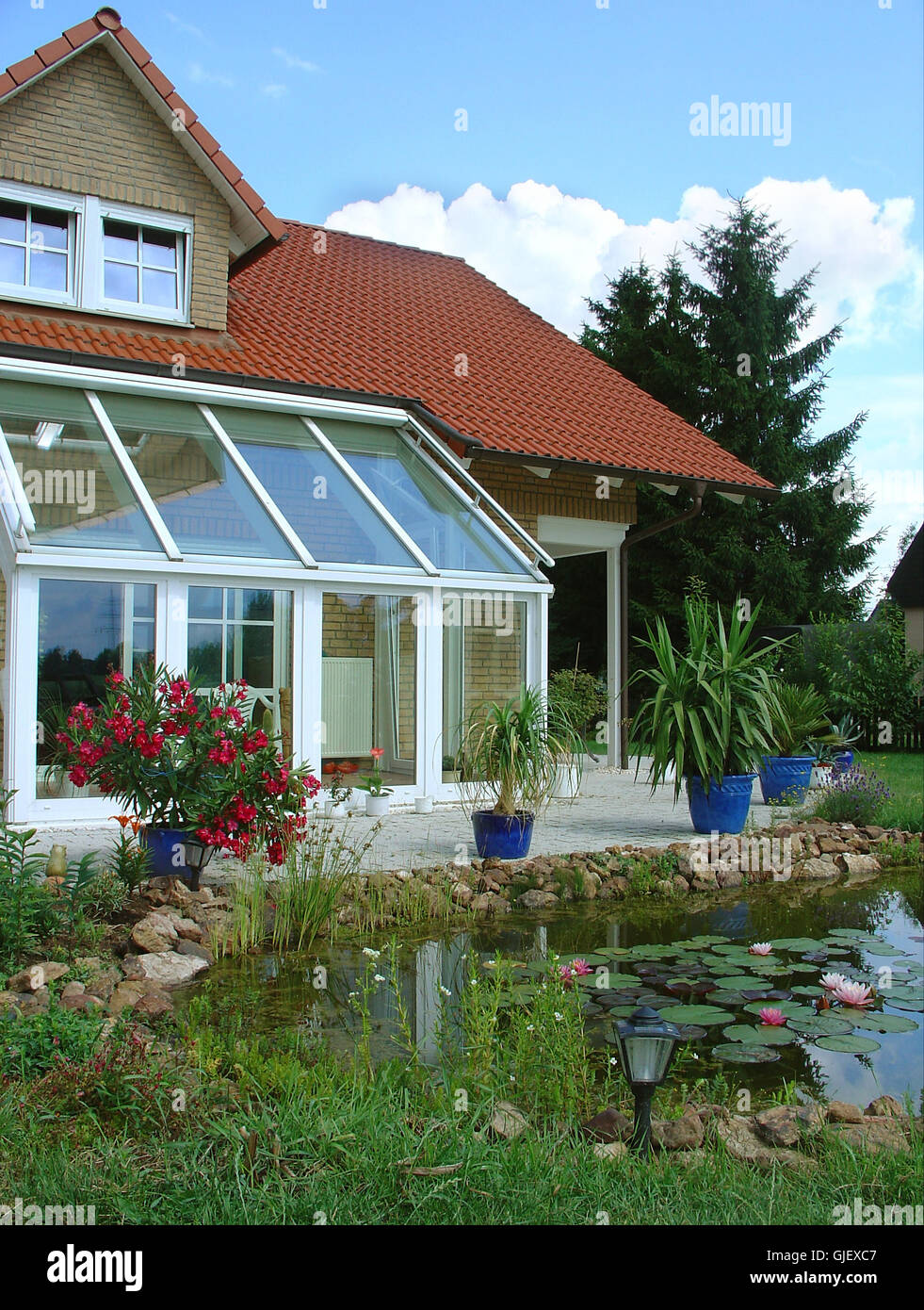 house with pond Stock Photo - Alamy