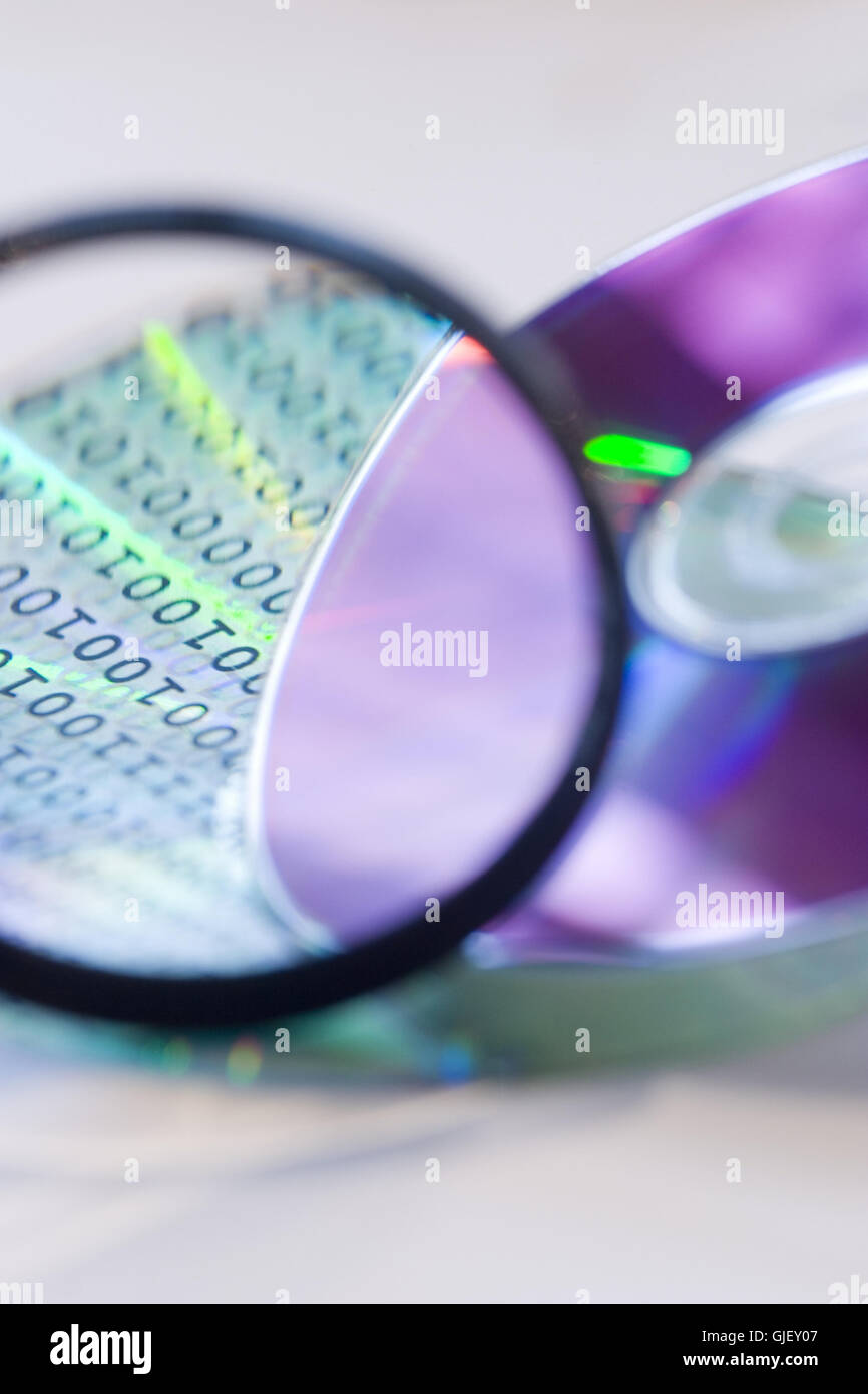digital data under magnifying glass Stock Photo - Alamy