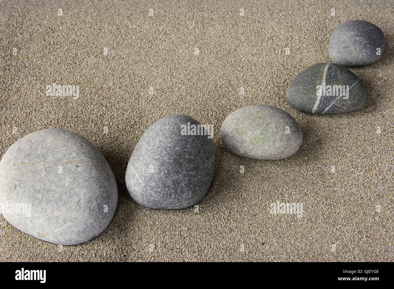 pebbles in the sand Stock Photo - Alamy