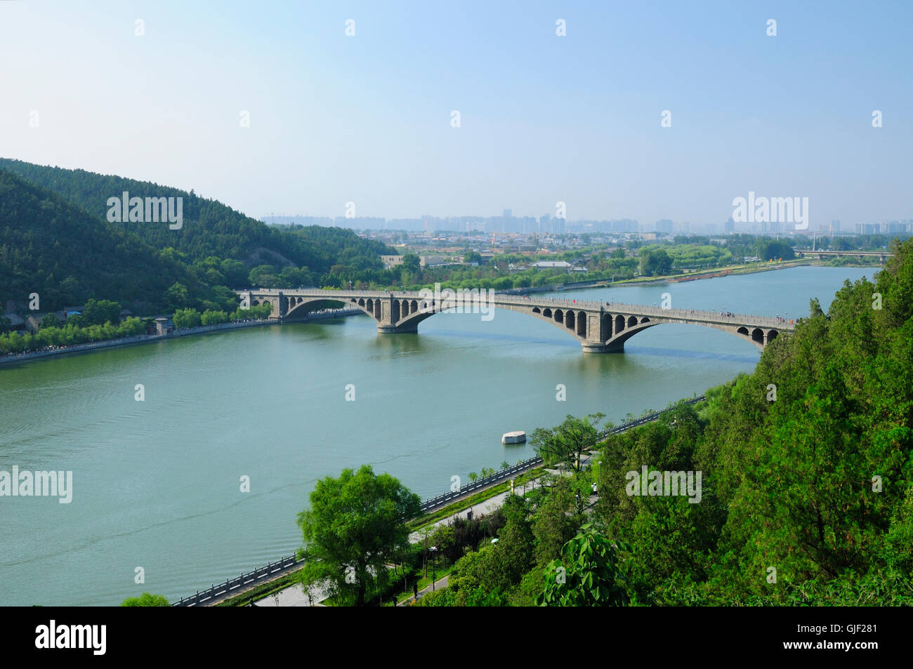 The Longmen Bridge over the Yi River at Longmen Grottoes in Luoyang ...