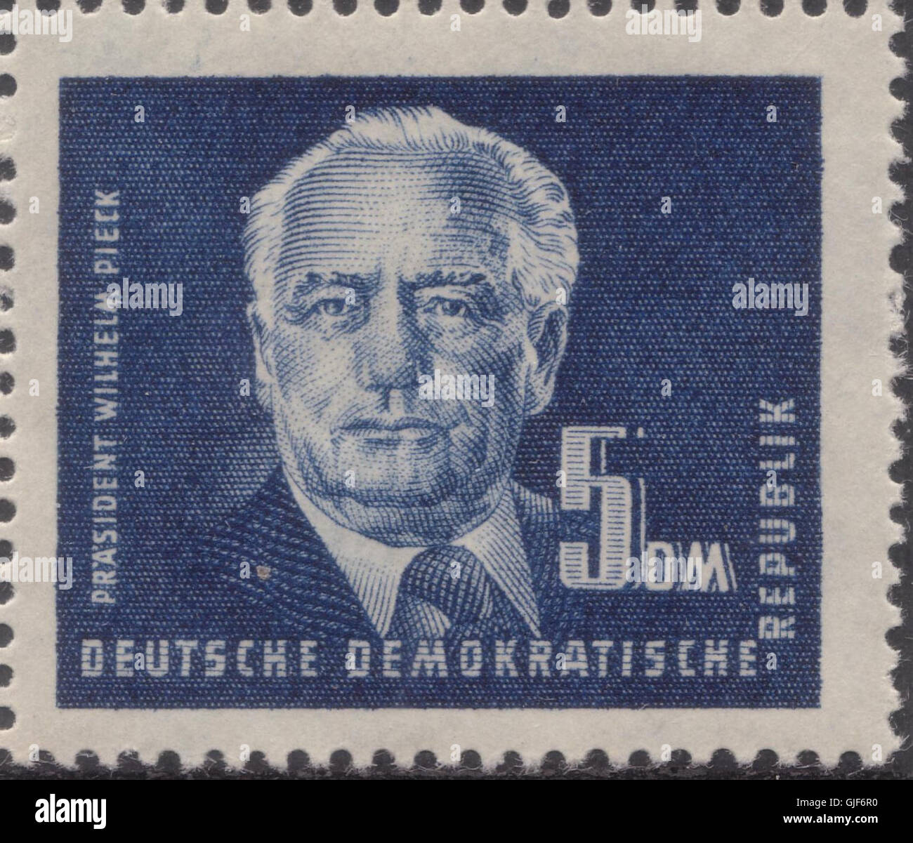 The DDR 1951 Pieck 5 DM stamp features a portrait of Wilhelm Pieck, the ...