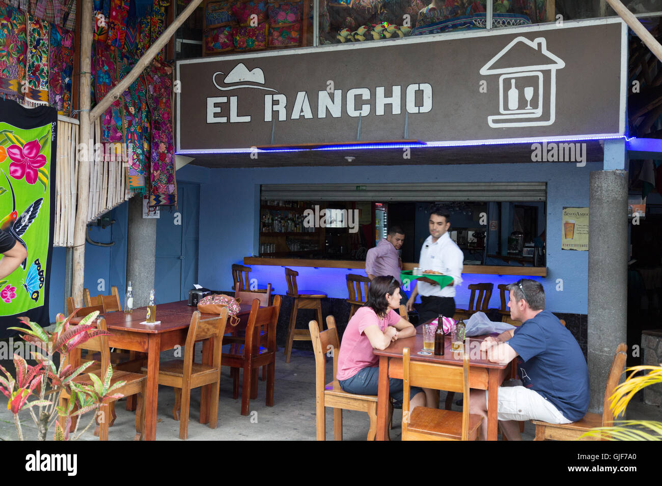 A couple drinking at a Costa Rica bar, La Fortuna town, Alajuela ...