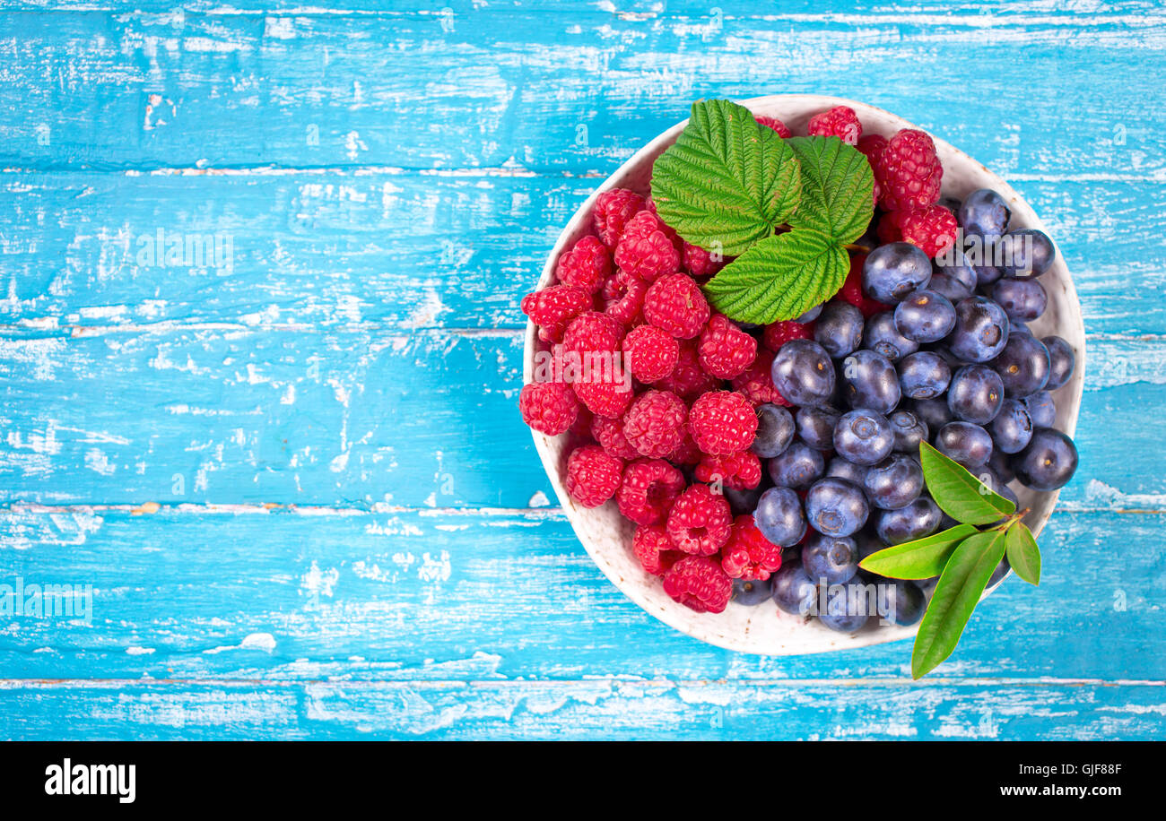 Bowl of raspberry and blueberry above Stock Photo - Alamy