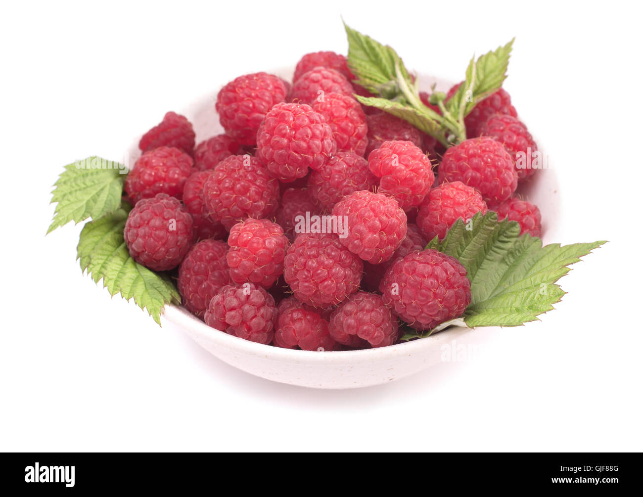 Bowl of raspberry isolated Stock Photo - Alamy