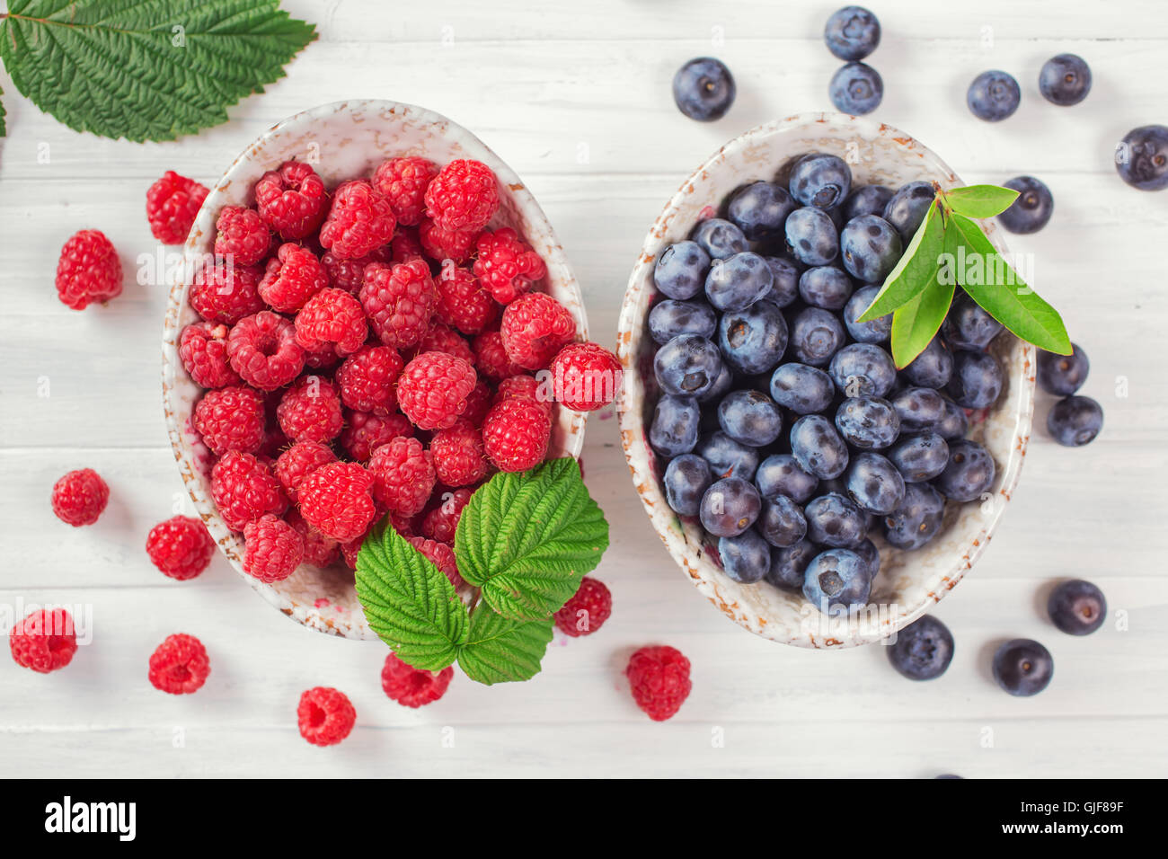 Bowls of blueberry and raspberry above Stock Photo - Alamy