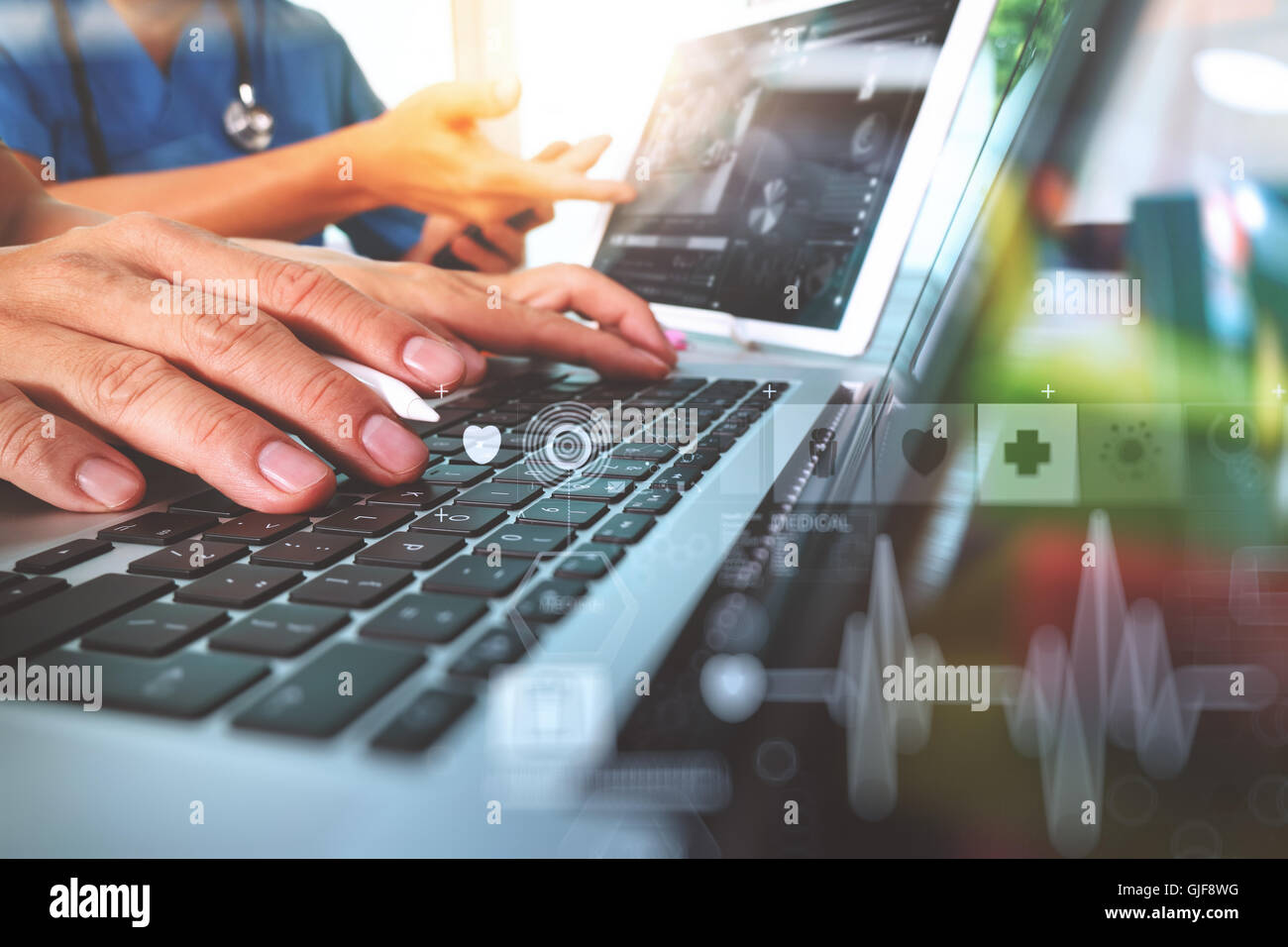 Medicine doctor hand working with modern computer and digital pro ...