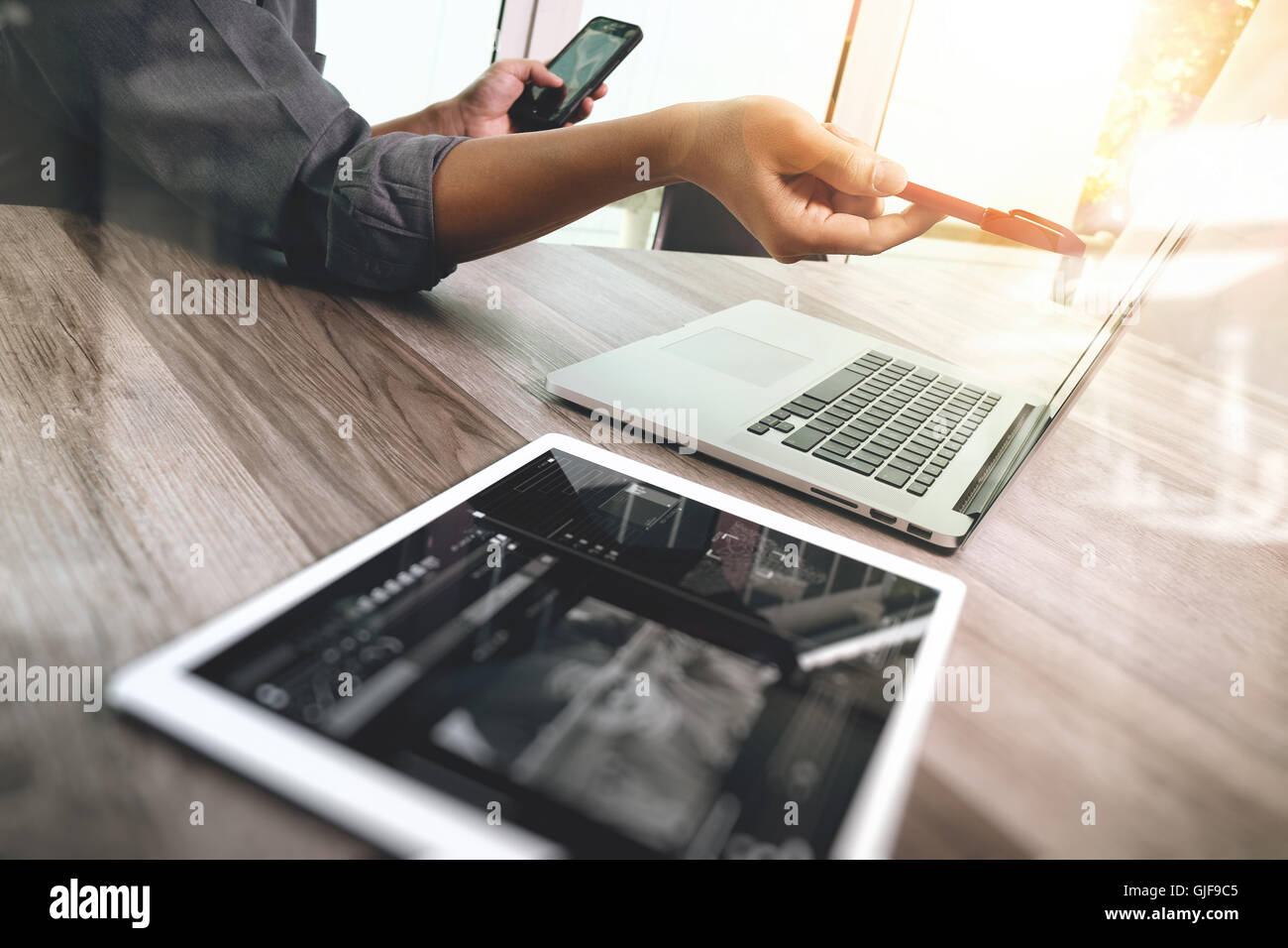 Businessman hand touching digital tablet.Photo finance manager working ...