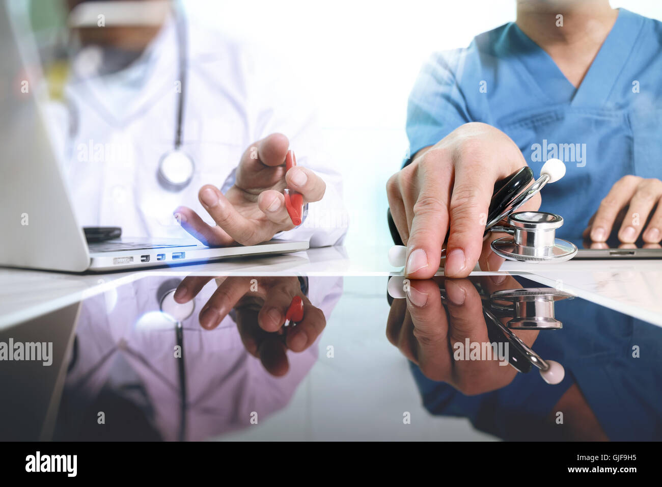 Medical technology network team concept. Doctor hand working with smart ...