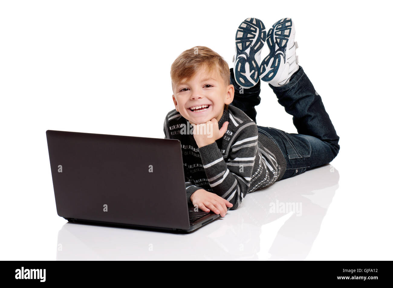 Boy with laptop Stock Photo - Alamy