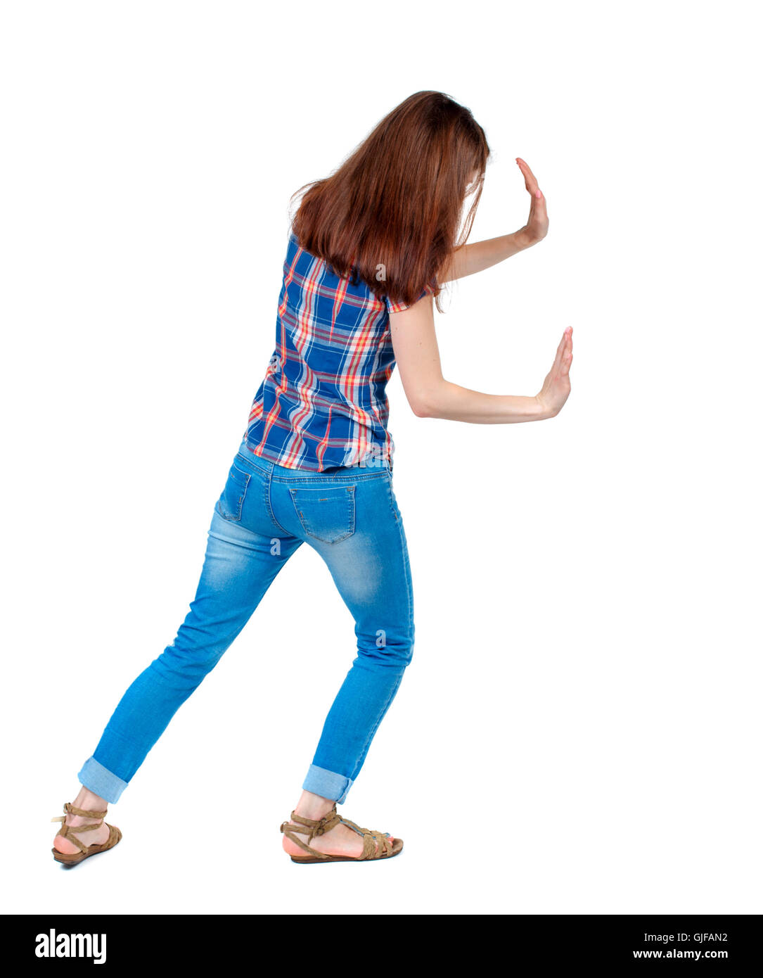 back view of woman pushes wall Stock Photo - Alamy