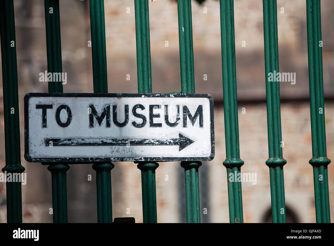 Color image of a signpost showing directions to the museum Stock Photo ...