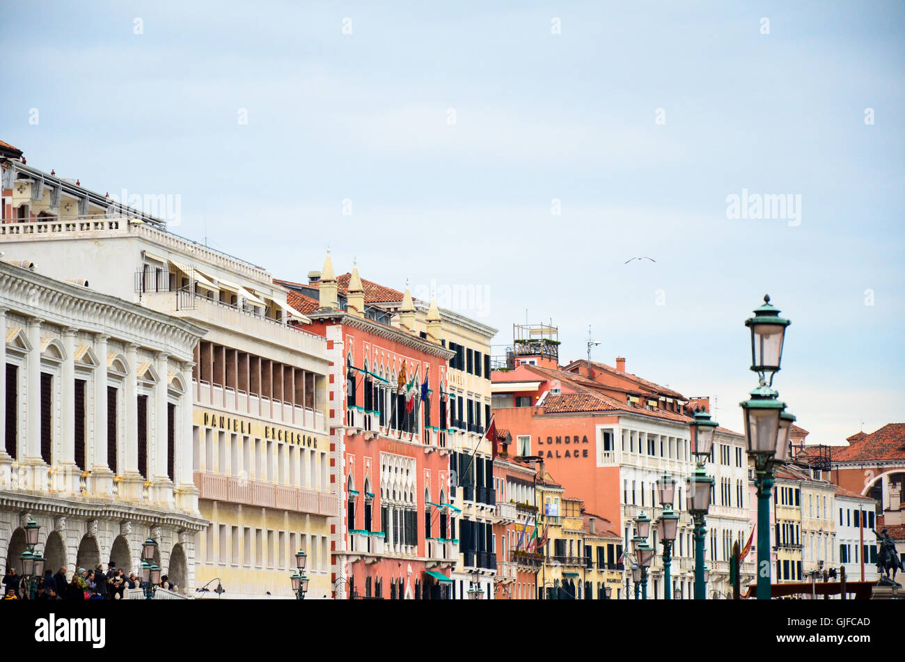 Traditional houses and lamp-posts along the Grand Canal in Venice ...