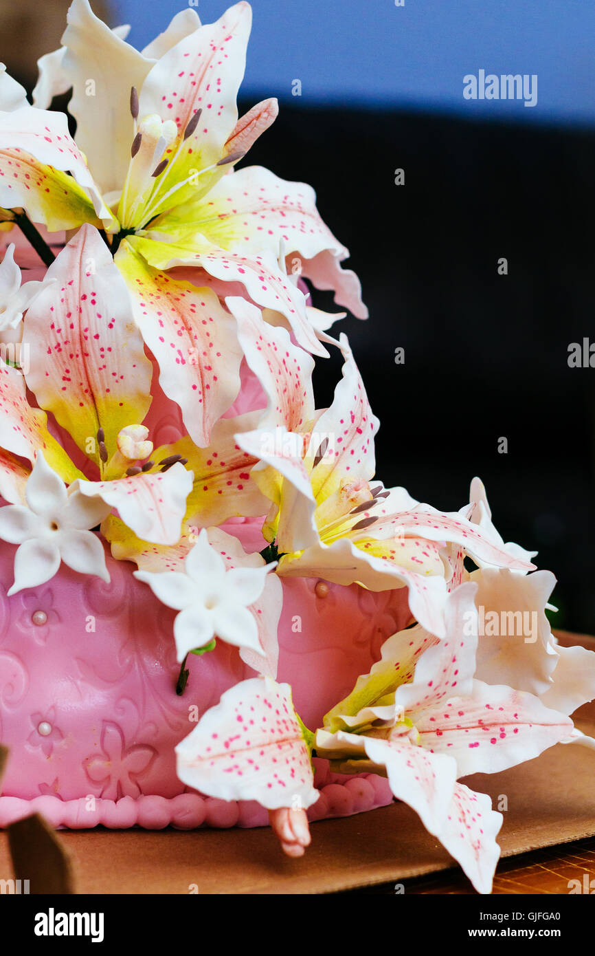 pink Wedding Cake with Lily Stock Photo - Alamy