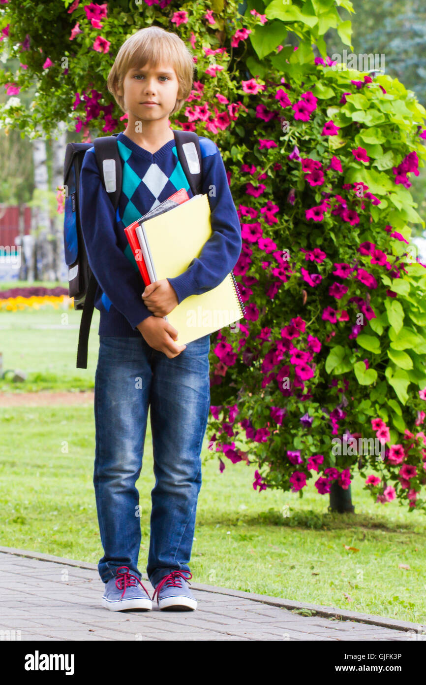 Little boy with a backpack go to school. Outdoor Stock Photo - Alamy