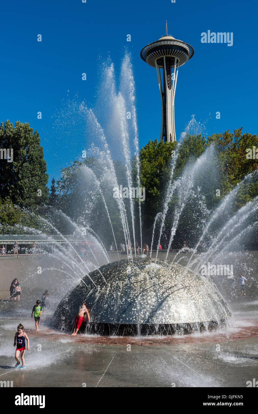 Children playing under the International Fountain in a hot summer day ...