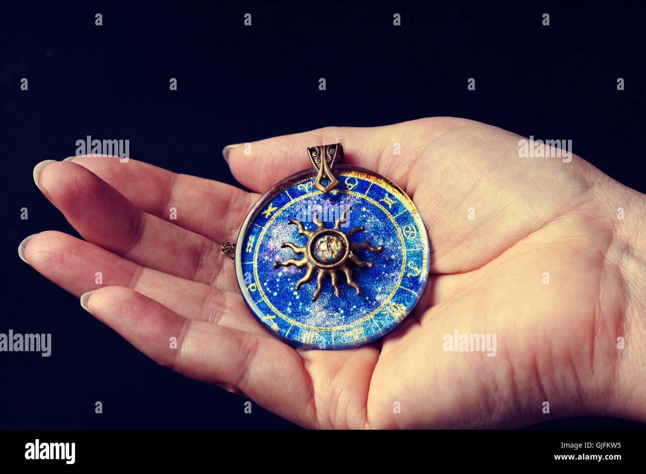 Hand holding astrological amulet hi-res stock photography and images ...