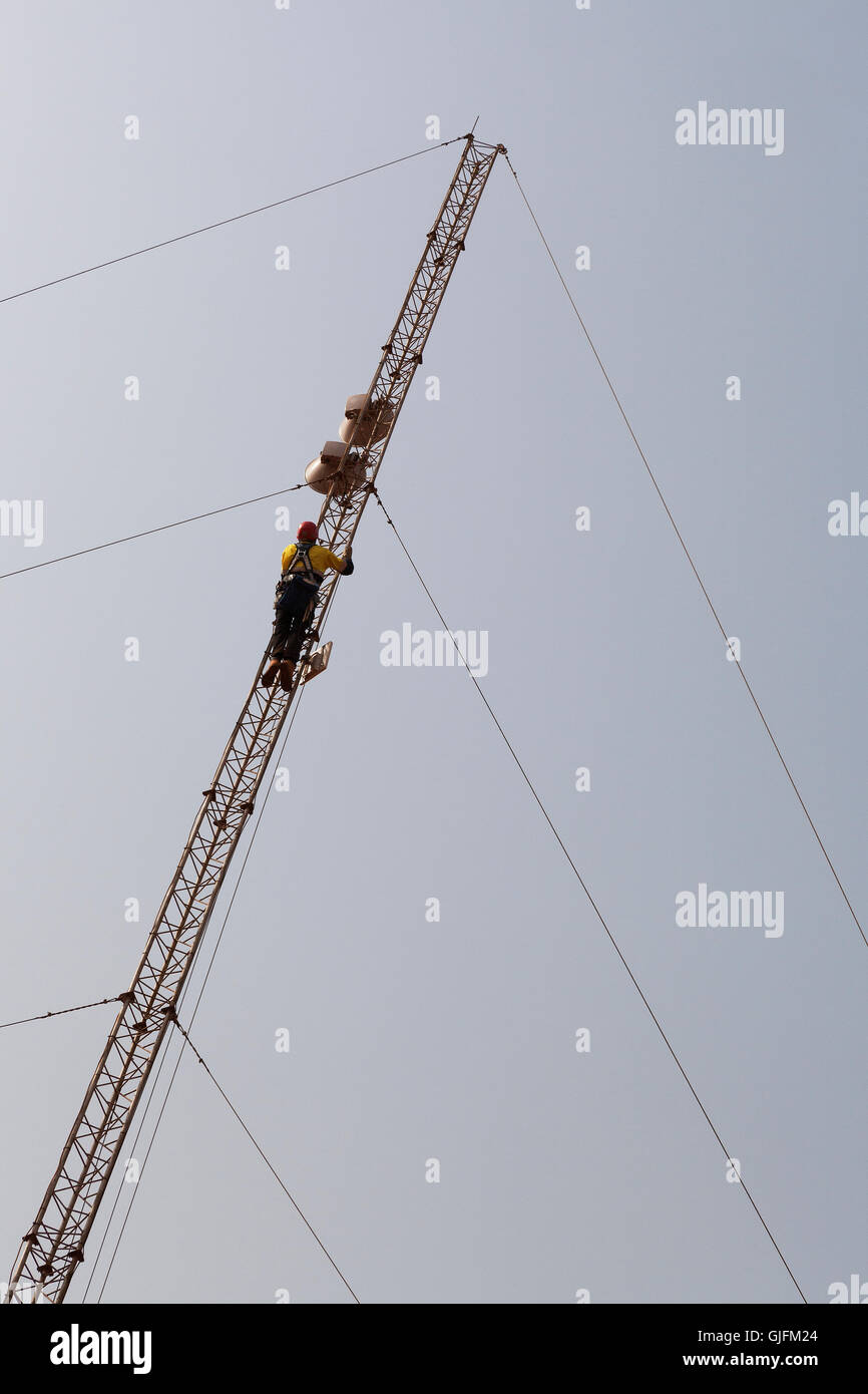 Iron ore mine in Sierra Leone. Telecoms engineer up tower working at ...