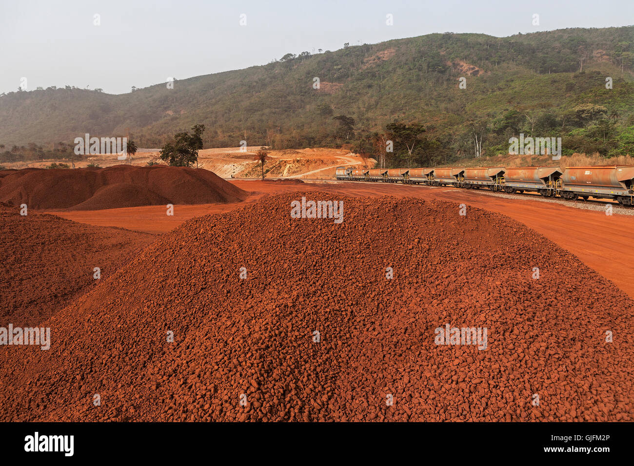 Rail head operations on iron ore mine. Wagons waiting to be loaded from ...